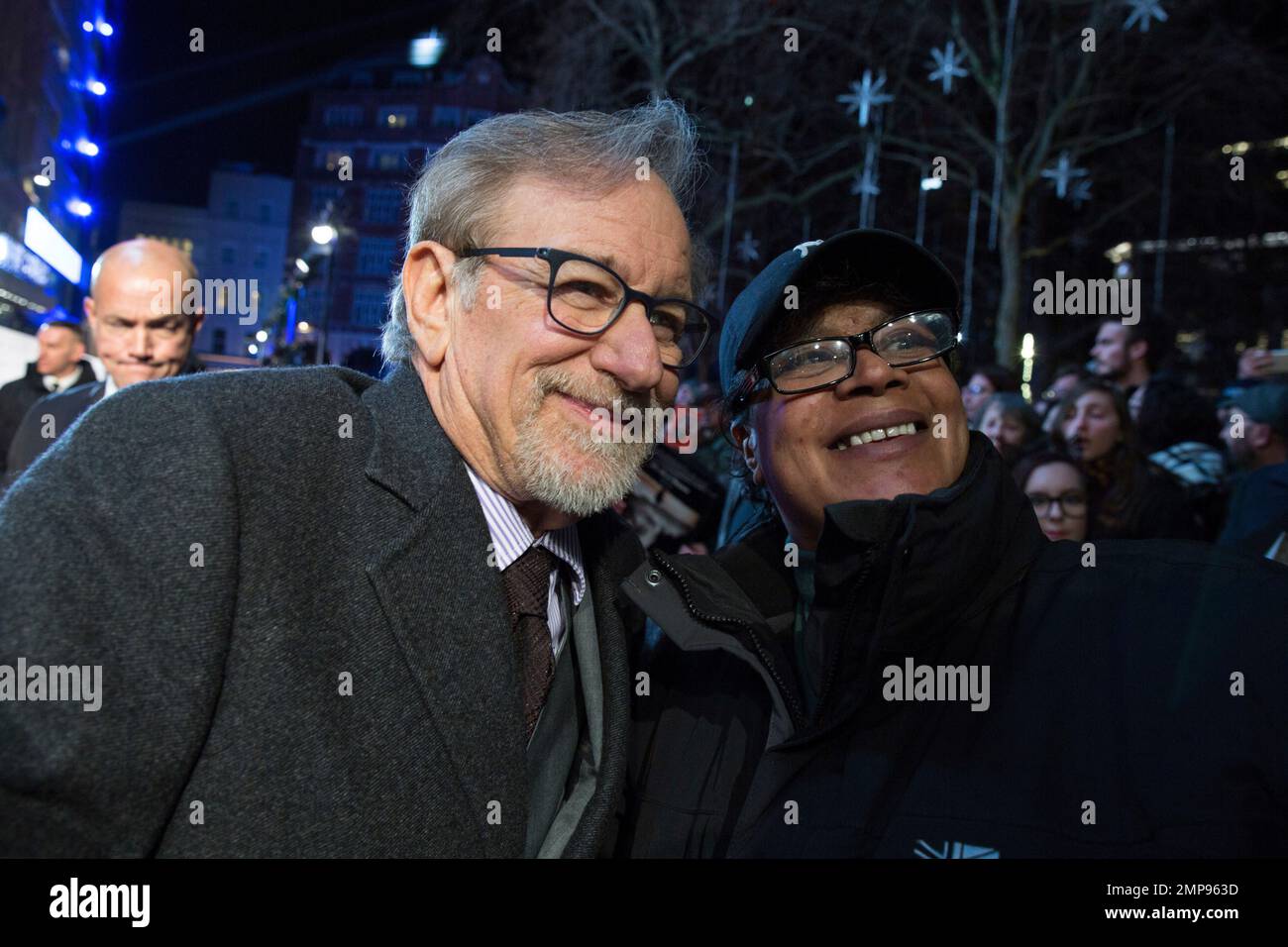 DIrector Steven Spielberg, left, poses with fans for photographs upon ...