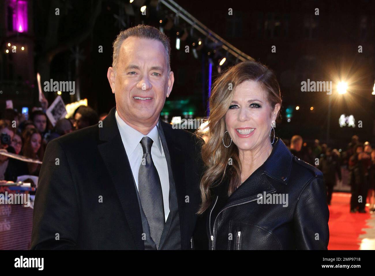 Actor Tom Hanks, left, and his wife Rita Wilson pose for photographers ...
