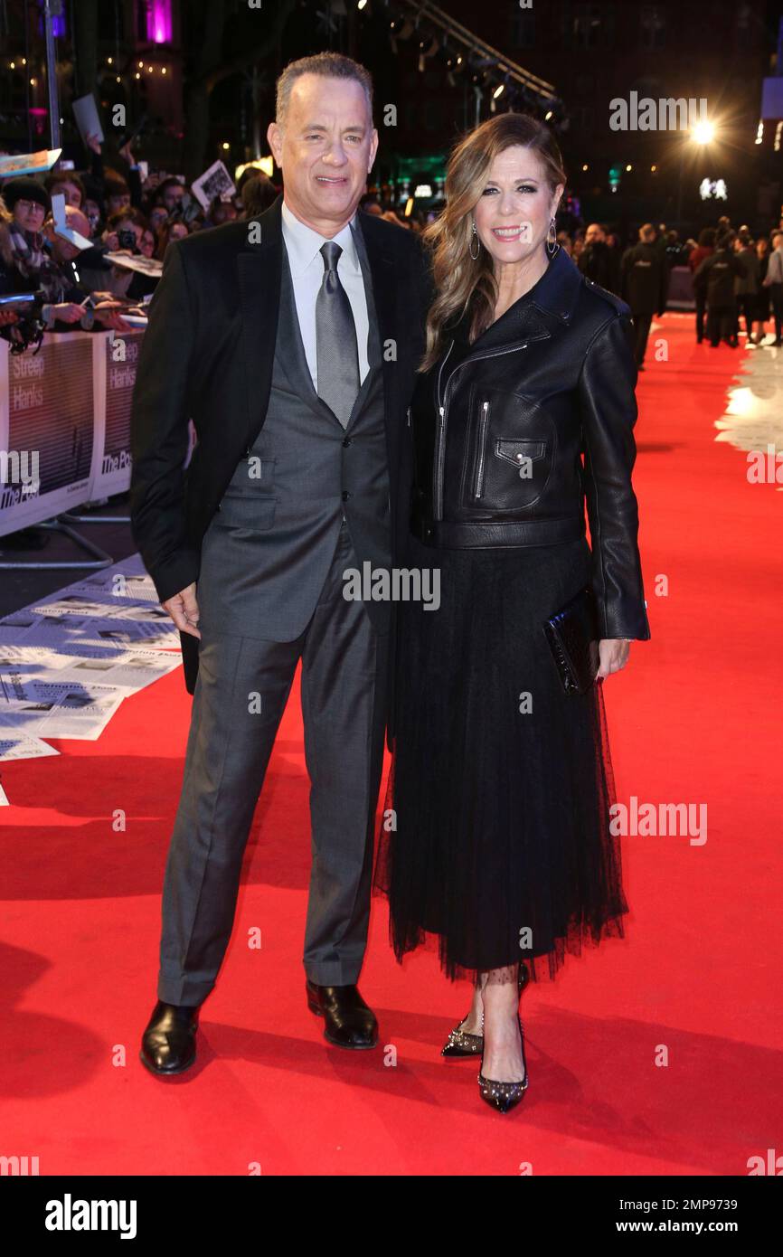 Actor Tom Hanks, left, and his wife Rita Wilson pose for photographers ...