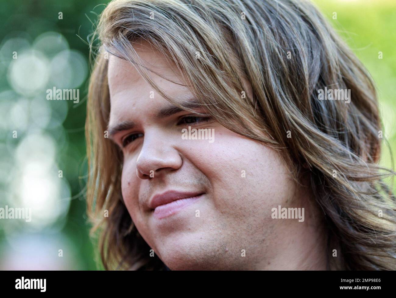 American Idol finalist Caleb Johnson walks the red carpet prior to his ...