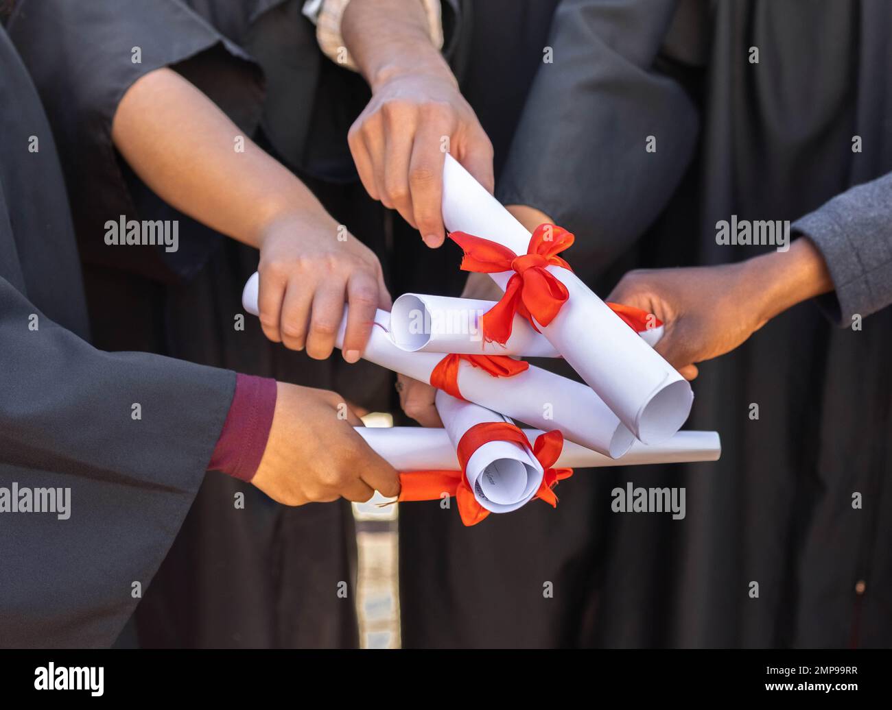 Graduation, graduate celebration and hands with diploma, together with ...