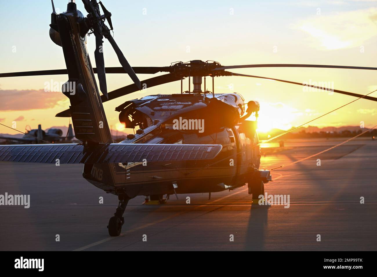 A U.S. Customs and Border Protection helicopter sits on the flightline ...