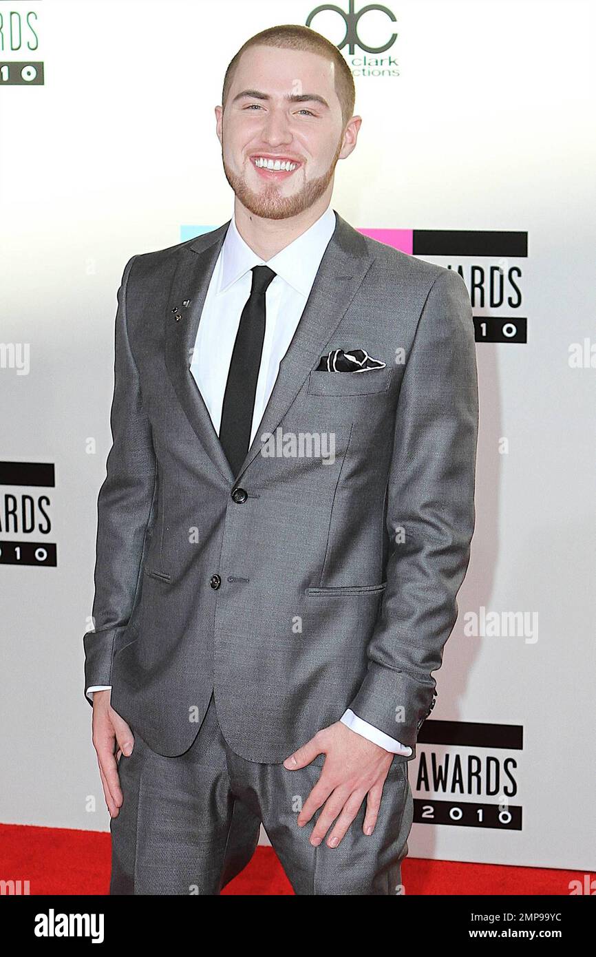 Mike Posner walks the red carpet at the 2010 American Music Awards at ...