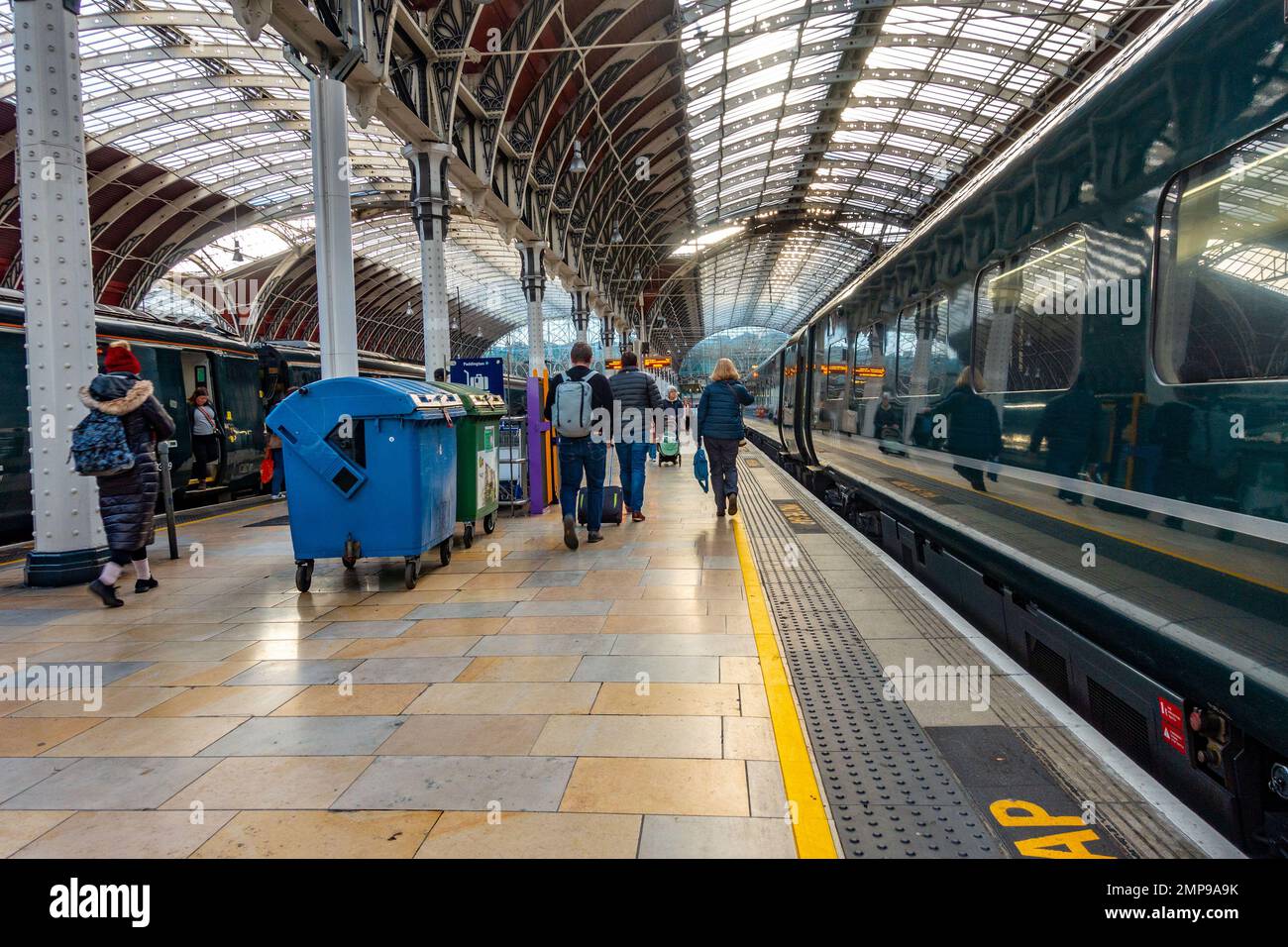 Passengers walking along the platform at Paddington Railway Station in ...
