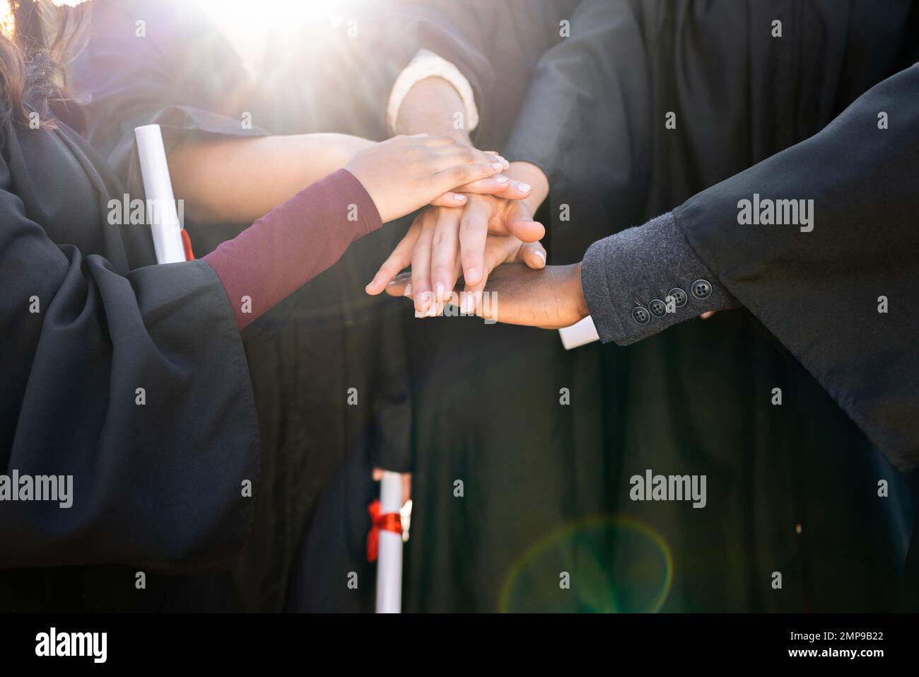 Graduation, graduate celebration and hands, together and support ...