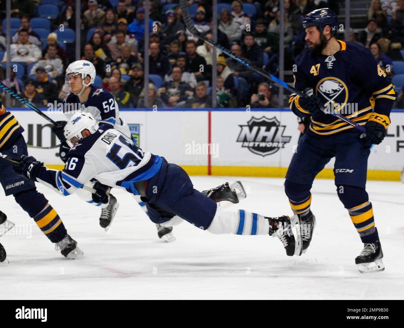 Buffalo Sabres defenseman Zach Bogosian (47) trips Winnipeg Jets ...