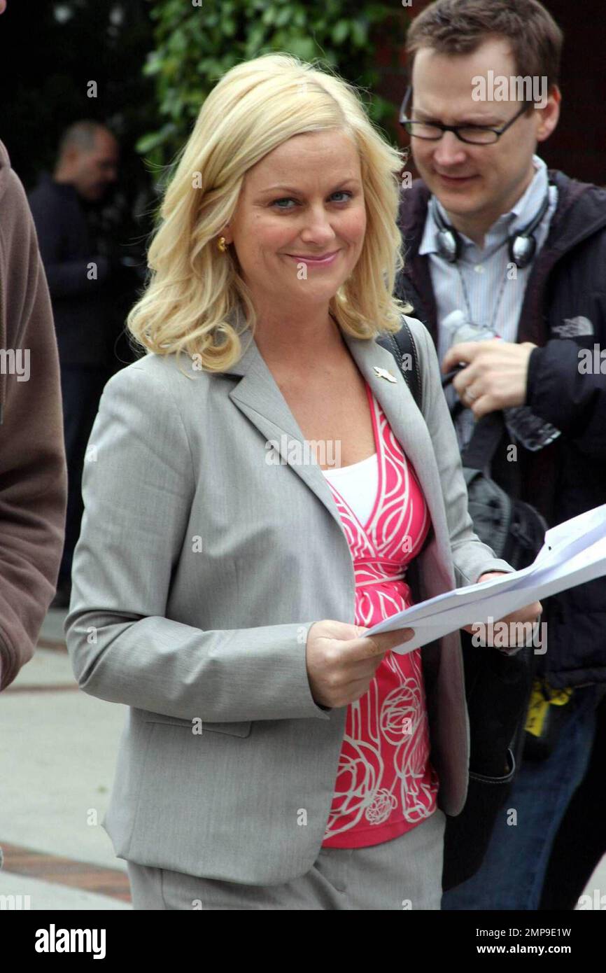 Comedienne and actress Amy Poehler goes over a script as she strolls on ...