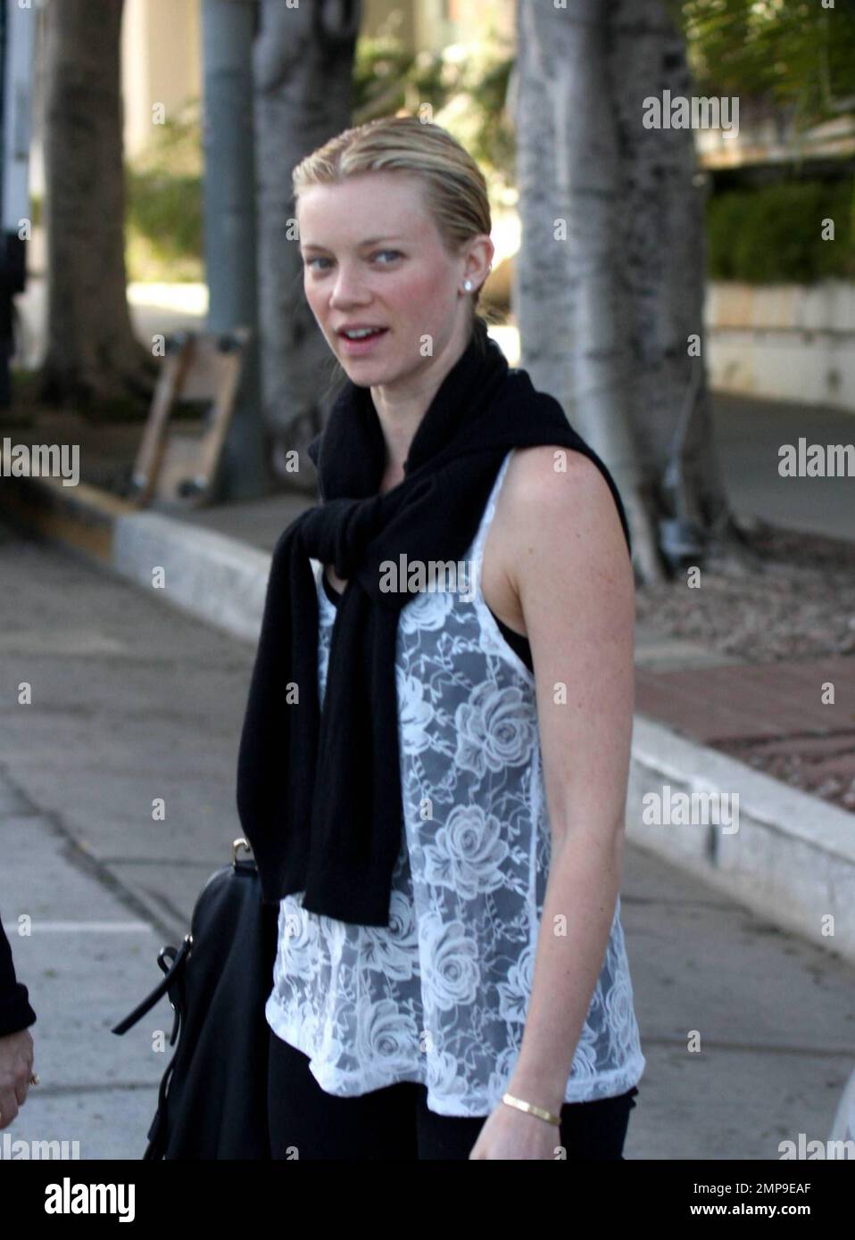 Actress Amy Smart is all laughs as she leaves Madeo's restaurant with a ...