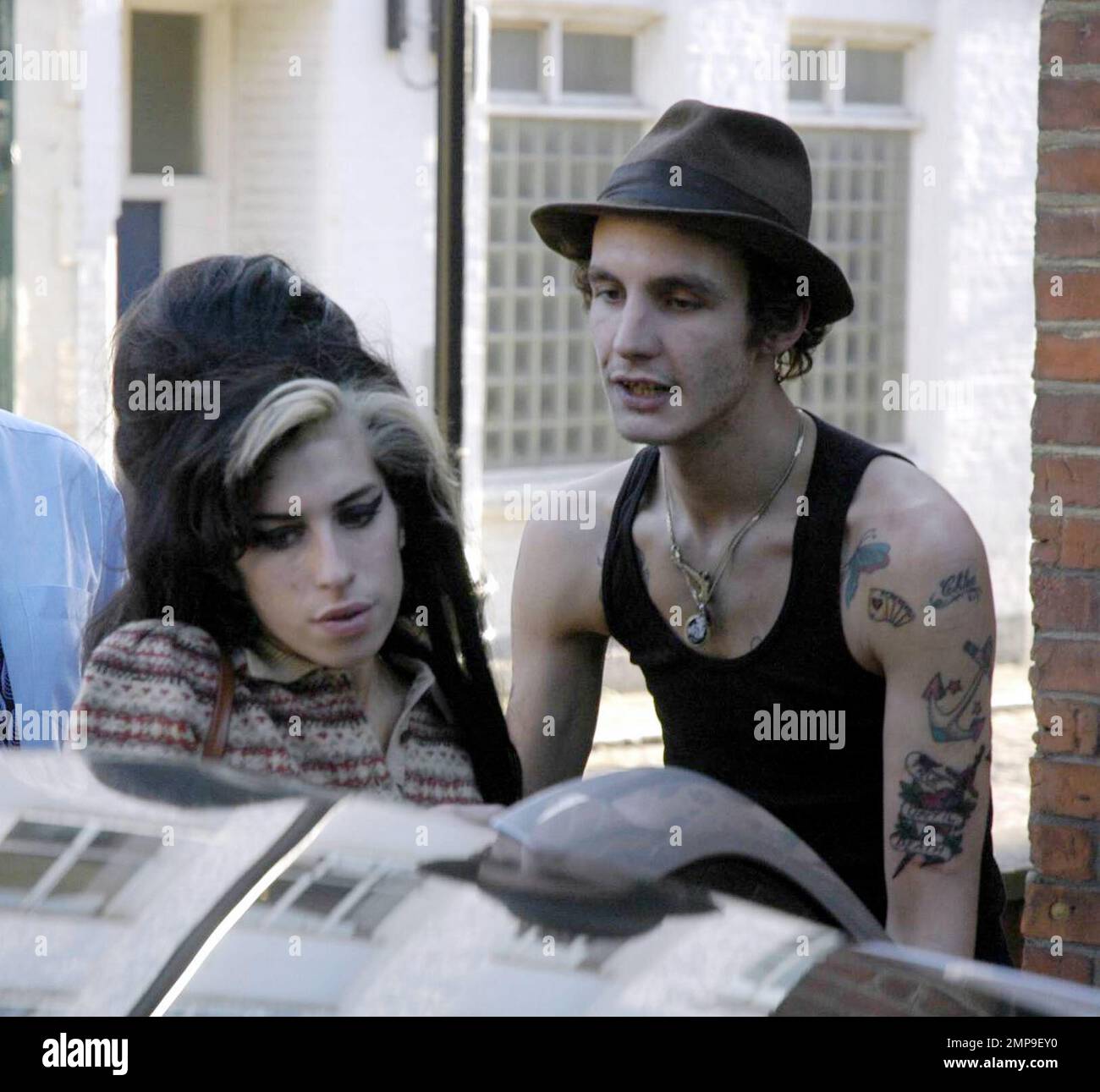 Amy Winehouse kisses husband Blake Fielder-Civil near her North London ...