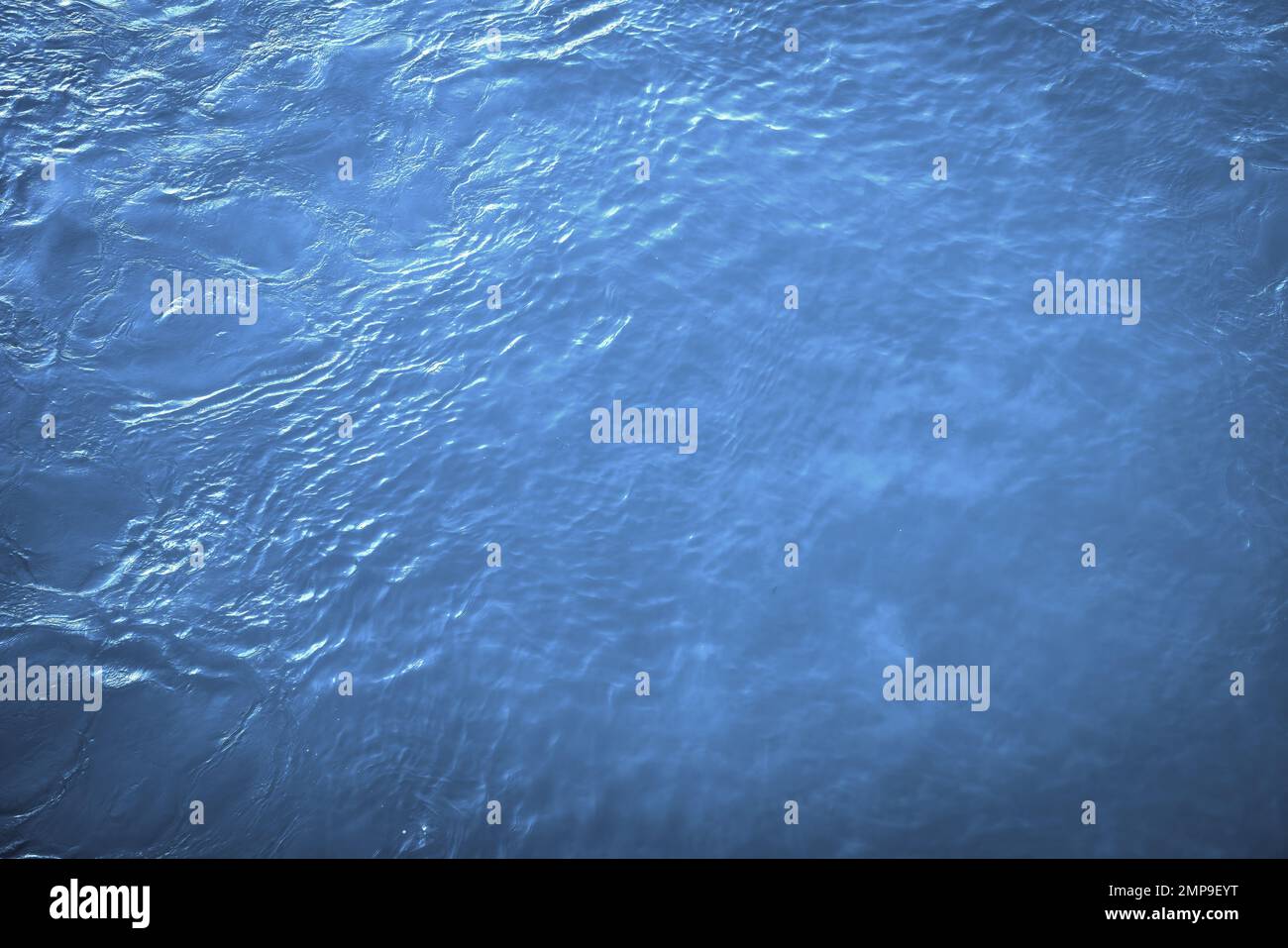 The texture of the waves of blue color of fast-flowing water in the ...