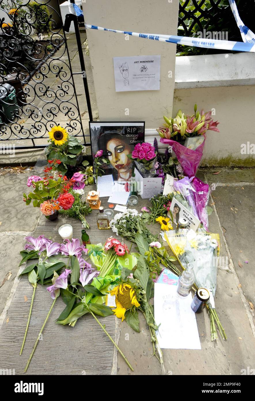 The makeshift memorial continues to grow outside late singer Amy ...