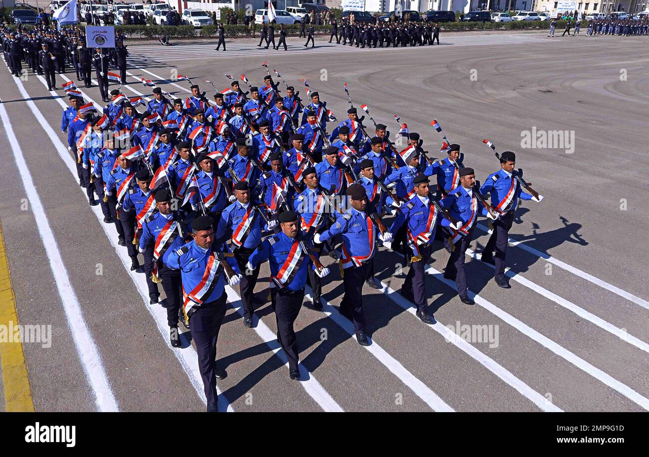 Iraqi police forces march during a ceremony marking Police Day in Basra ...