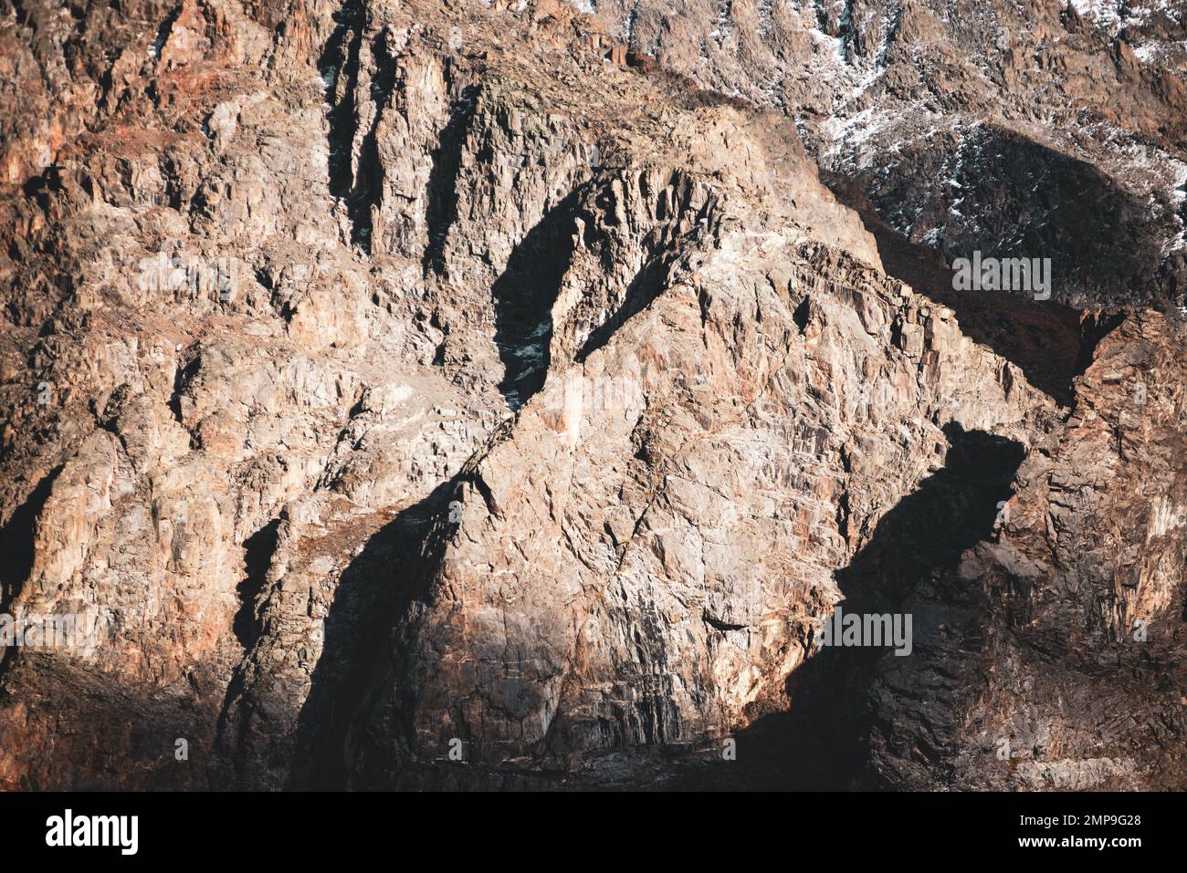 The sun illuminates a stone rock in the shade Stock Photo - Alamy