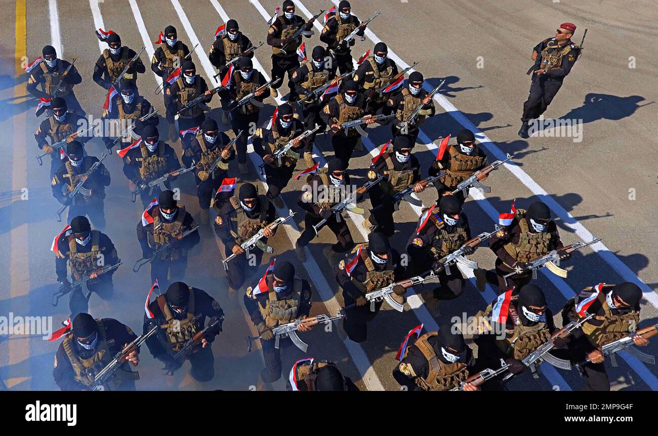 Iraqi police commandos march during a ceremony marking Police Day in ...