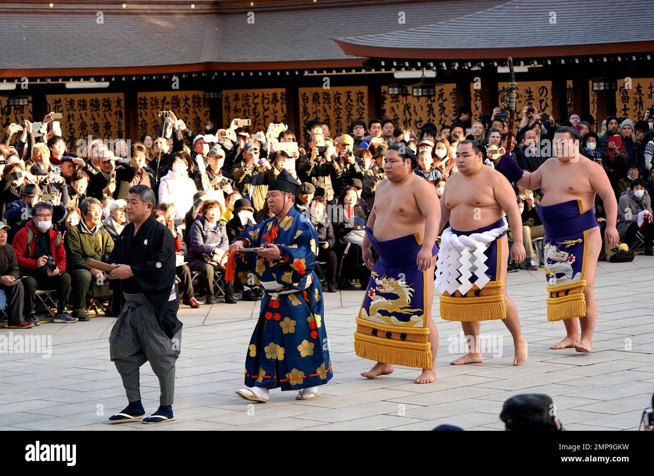 Sumo grand champion Kakuryu, second from right, of Mongolia arrives to ...