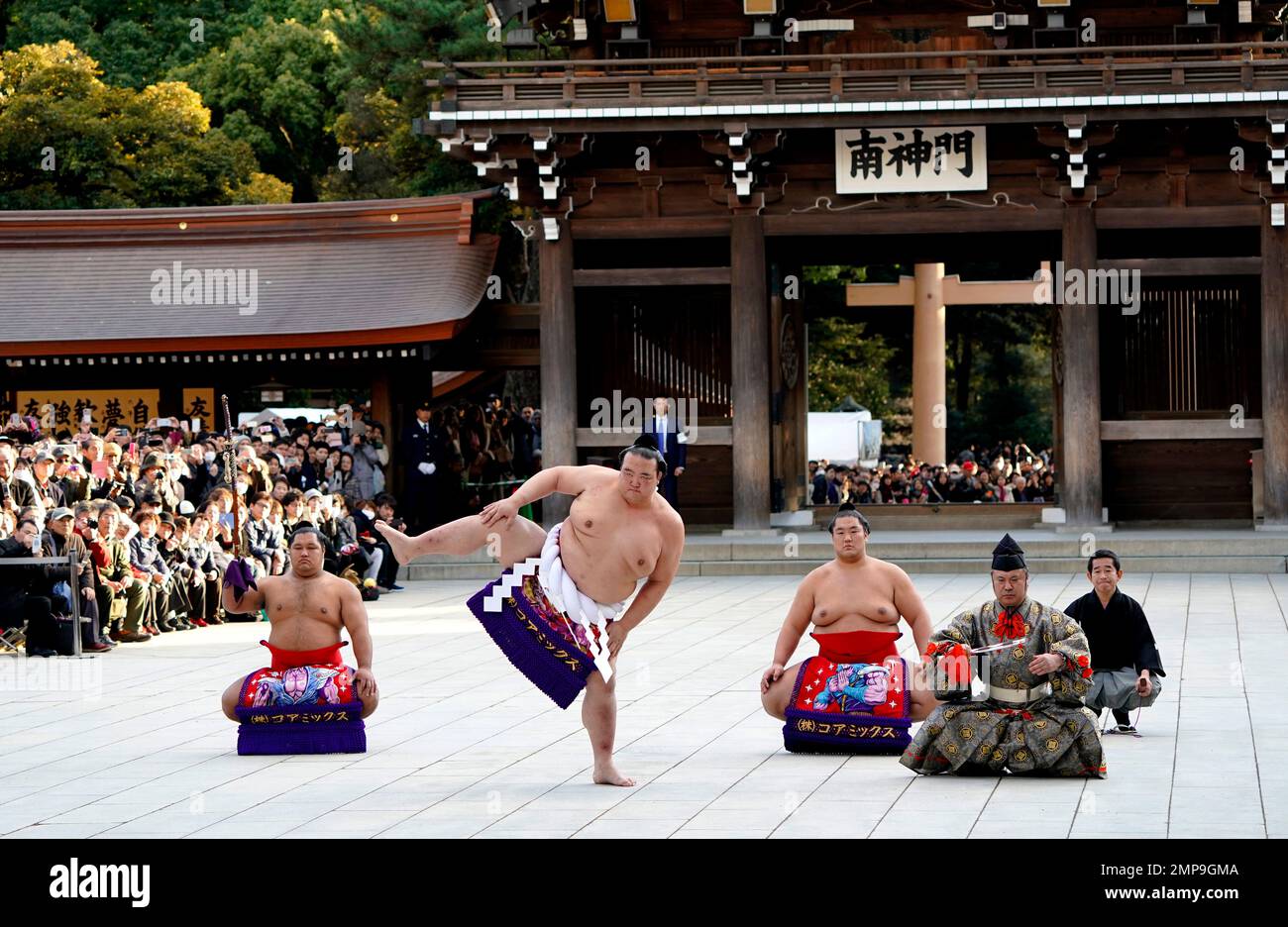 Sumo grand champion Kisenosato, second from left, of Japan performs his ...