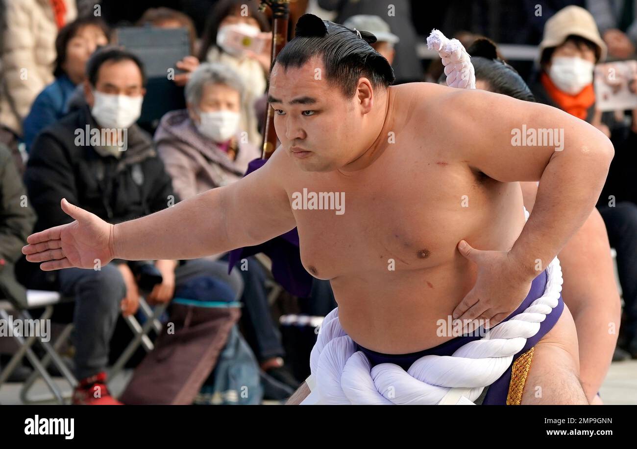 Sumo grand champion Kakuryu of Mongolia performs his ring entry form at ...