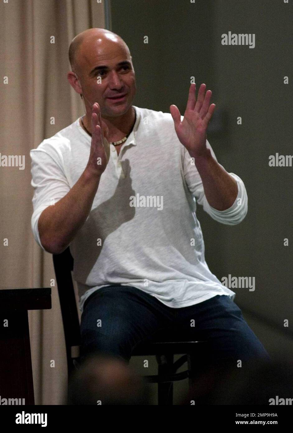 Tennis great Andre Agassi signs copies of his new book "Open: An ...