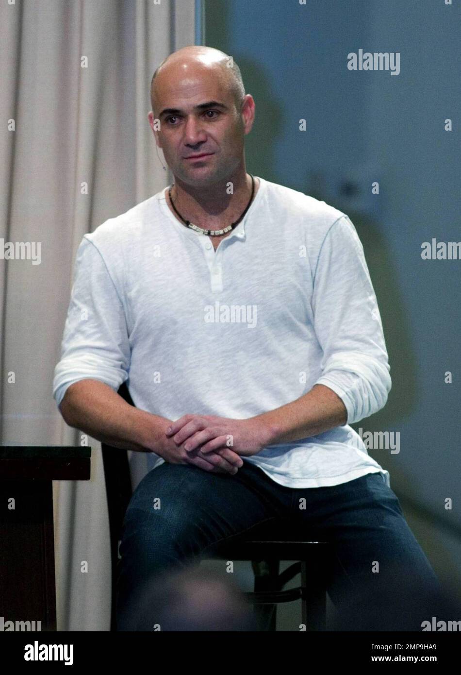 Tennis great Andre Agassi signs copies of his new book "Open: An ...