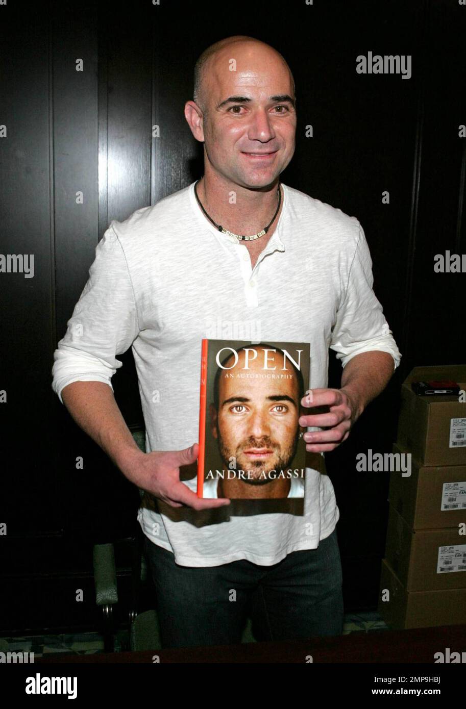 Tennis great Andre Agassi signs copies of his new book "Open: An ...