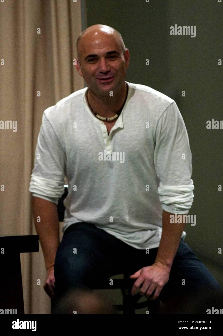Tennis great Andre Agassi signs copies of his new book "Open: An ...