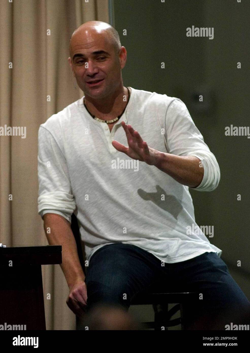 Tennis great Andre Agassi signs copies of his new book "Open: An ...