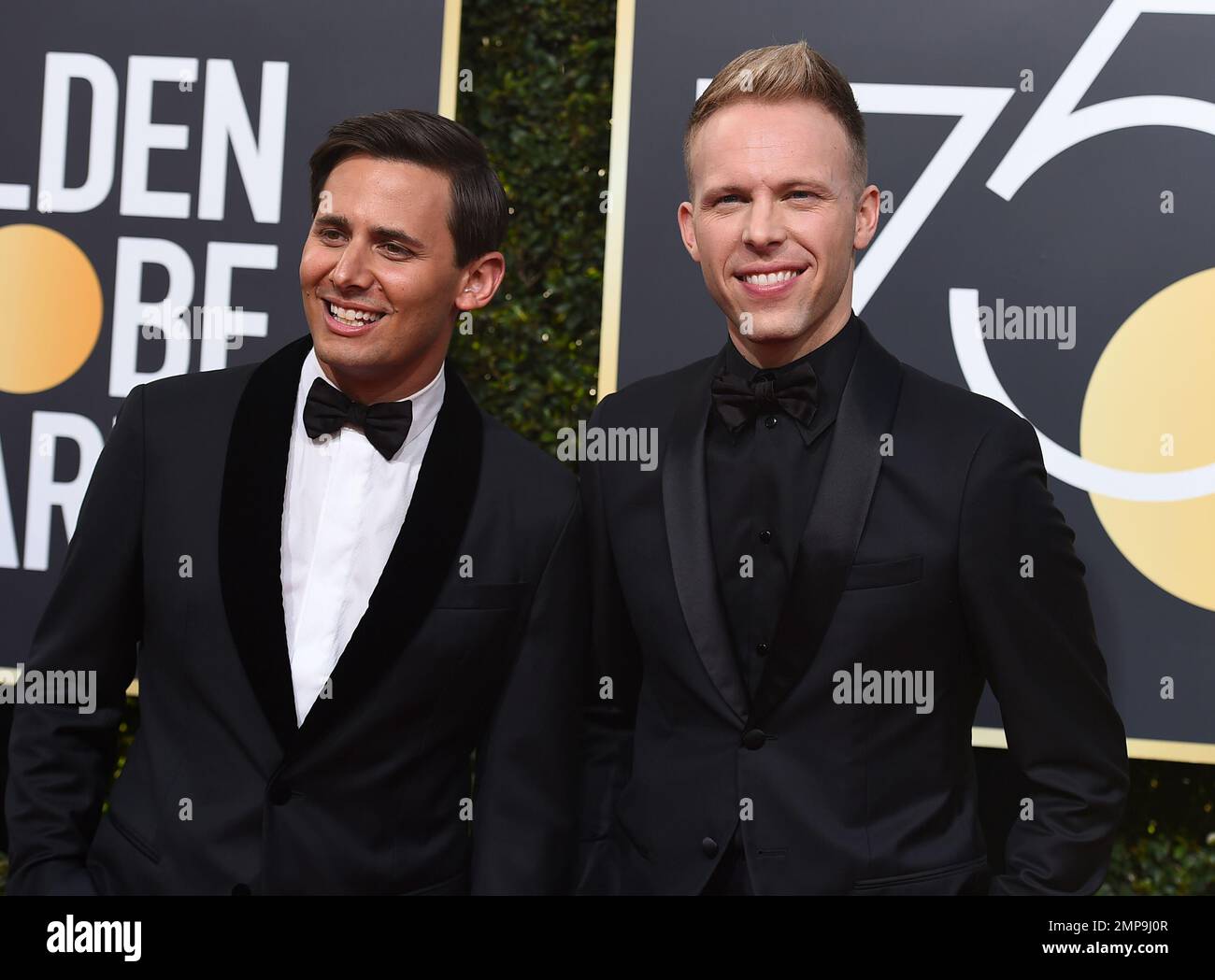 Benj Pasek, left, and Justin Paul arrive at the 75th annual Golden ...