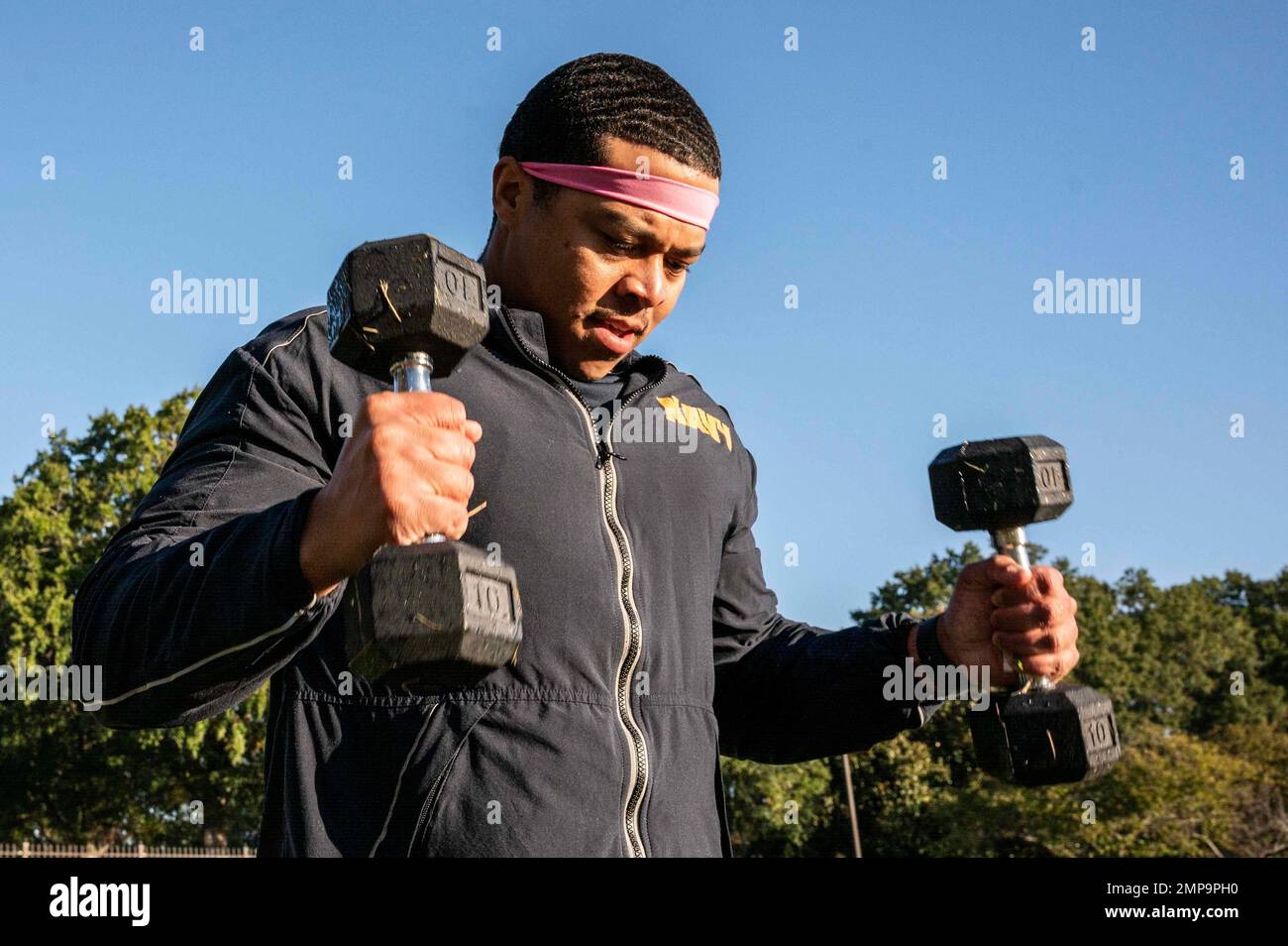 Yeoman 1st Class Jonathan Caldwell curls dumbbells during a Sailor 360 ...