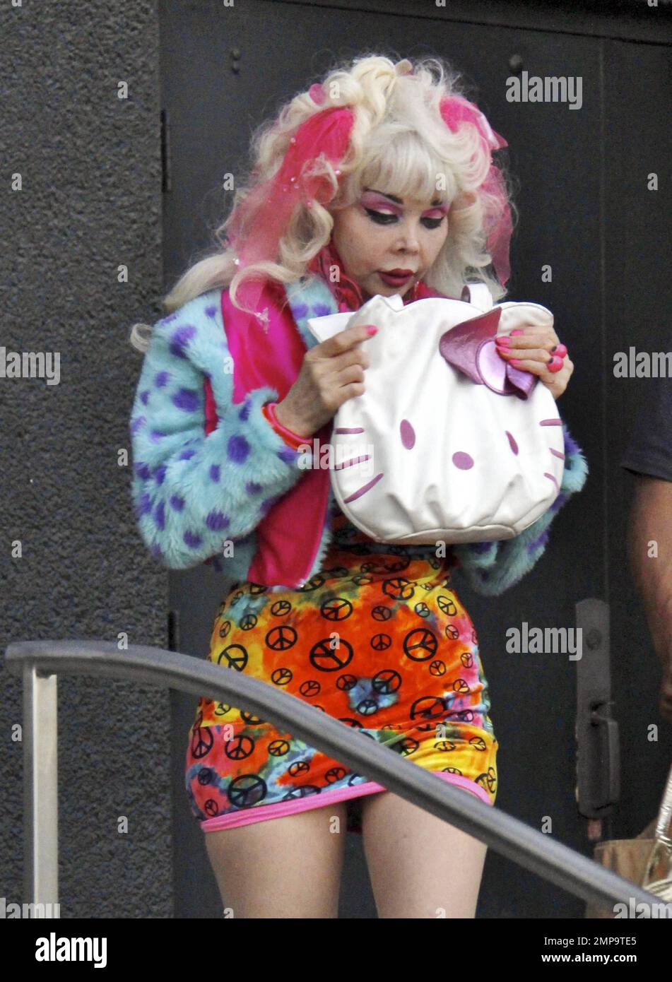 Model and actress Angelyne wears a wildly colorful and outrageous ...