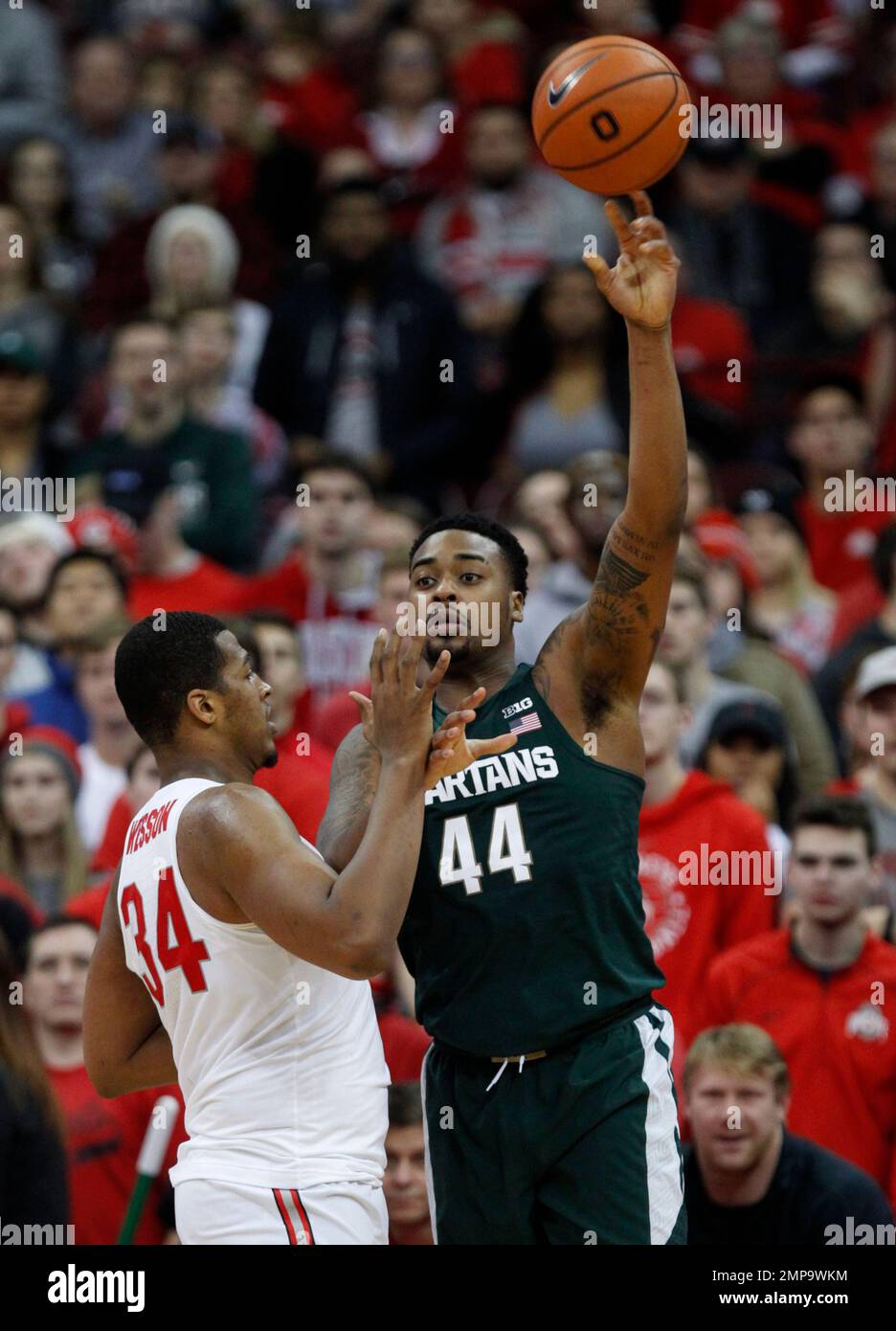 Michigan State forward Nick Ward, right, passes the ball against Ohio ...