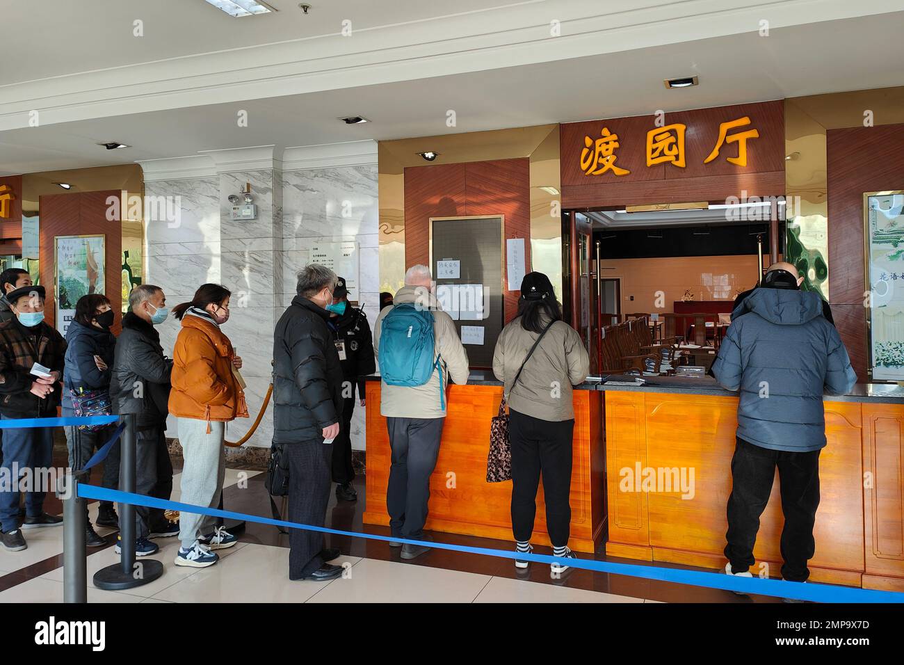 SHANGHAI, CHINA - JANUARY 31, 2023 - Family members line up at a ...