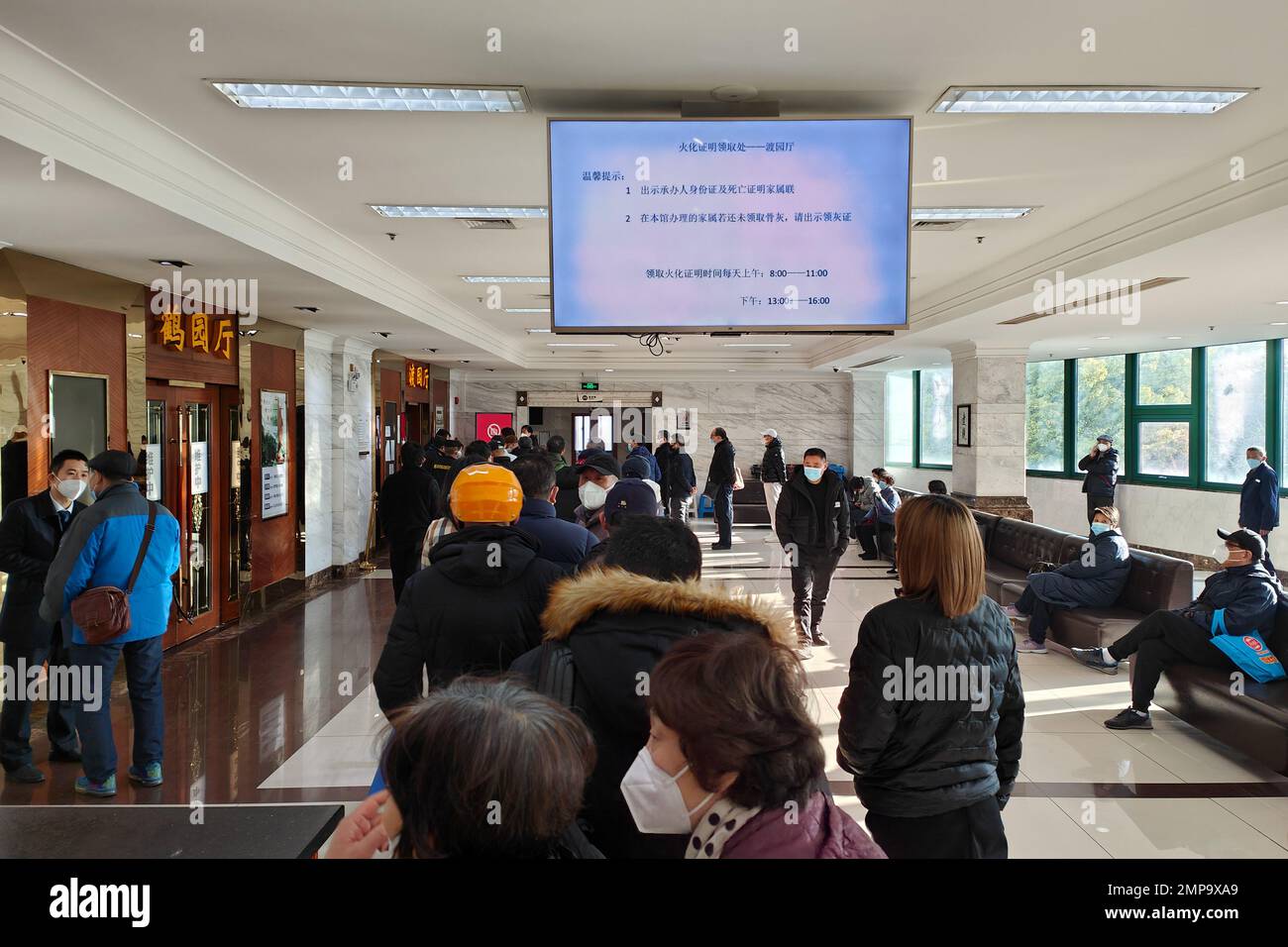 SHANGHAI, CHINA - JANUARY 31, 2023 - Family members line up at a ...