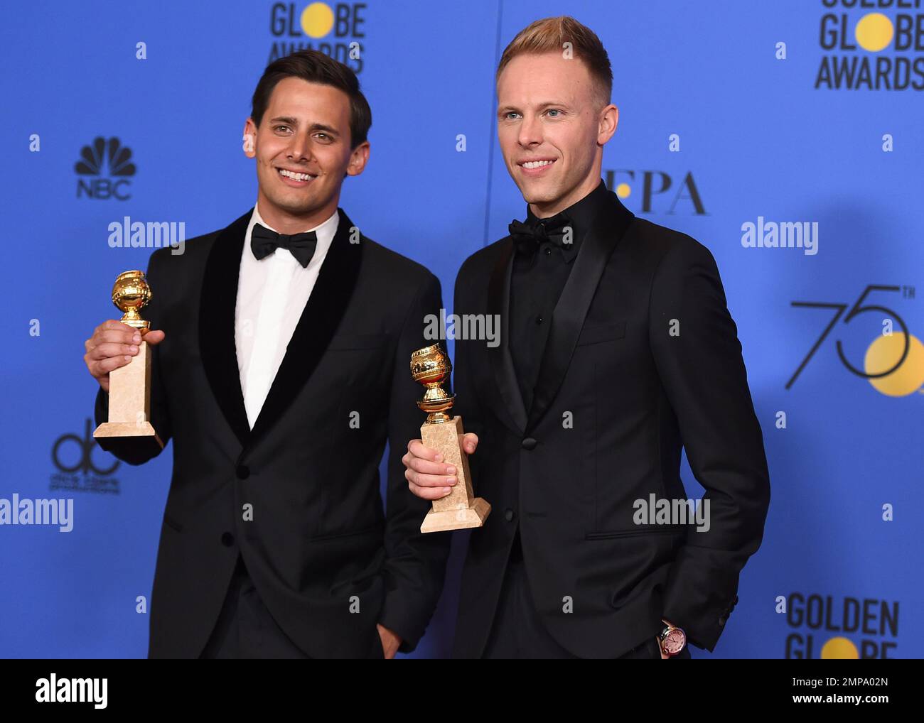 Benj Pasek, left, and Justin Paul pose in the press room with the award ...