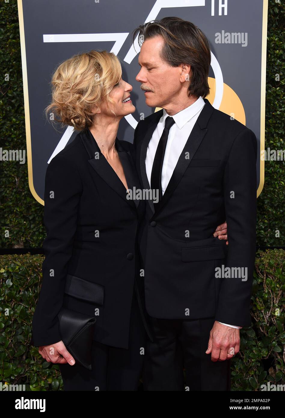 Kyra Sedgwick, left, and Kevin Bacon arrive at the 75th annual Golden ...