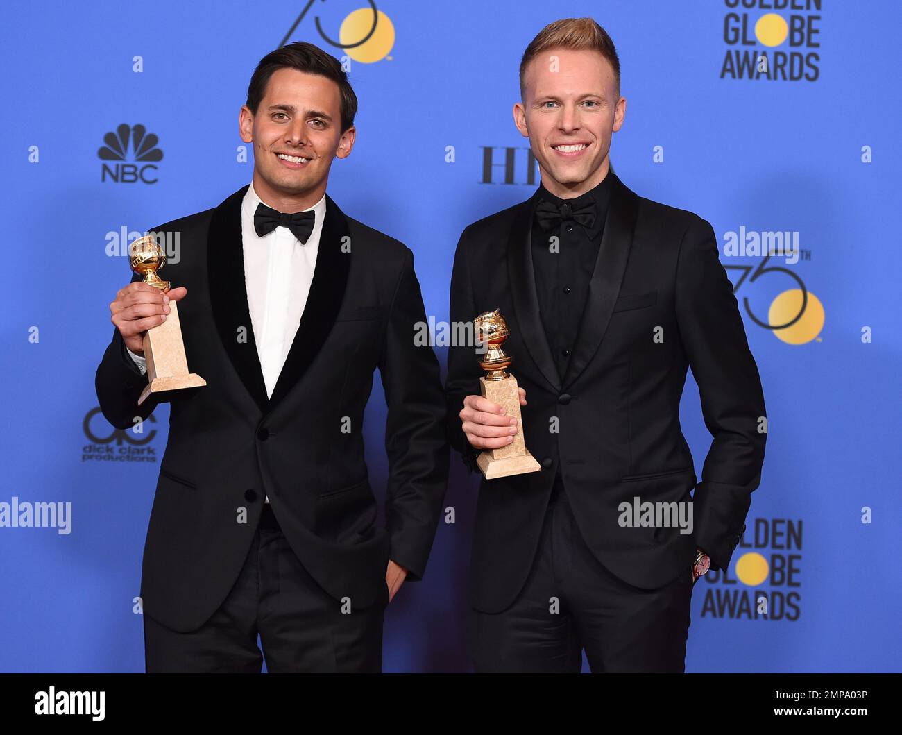 Benj Pasek, left, and Justin Paul pose in the press room with the award ...