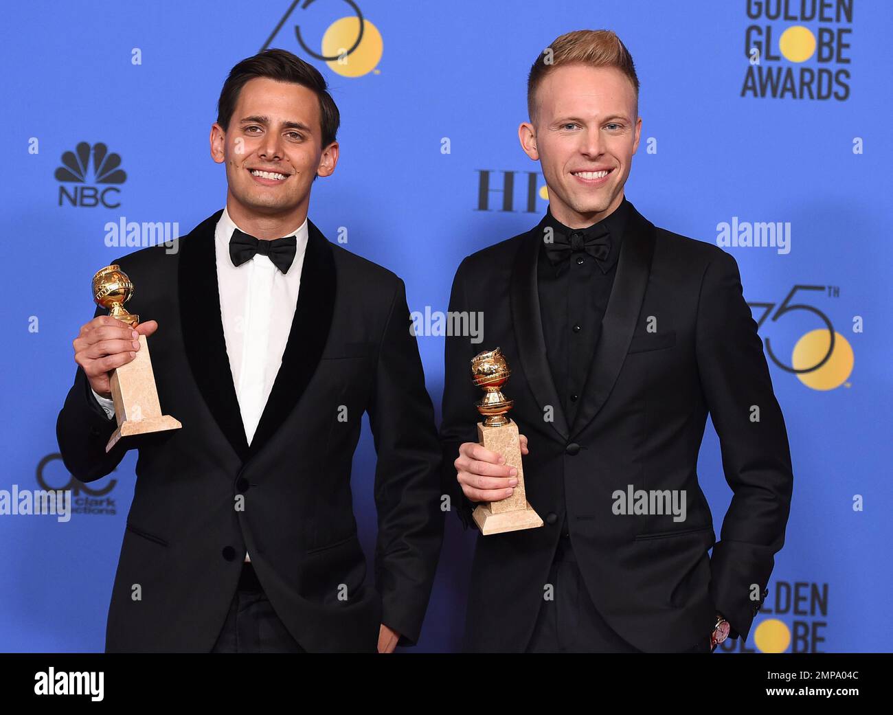 Benj Pasek, left, and Justin Paul pose in the press room with the award ...