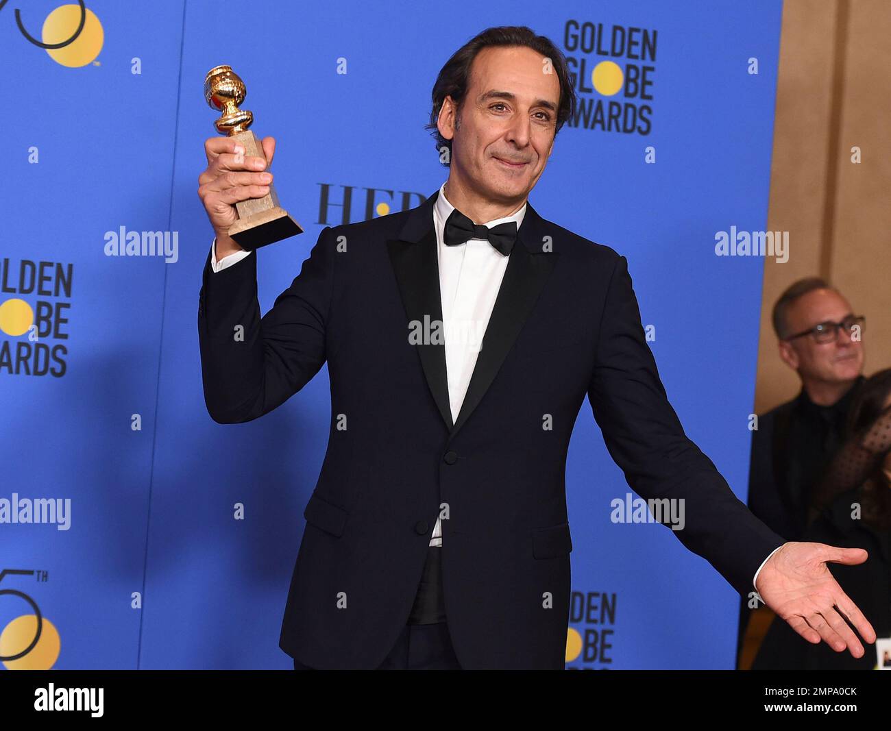Alexandre Desplat poses in the press room with the award for best ...
