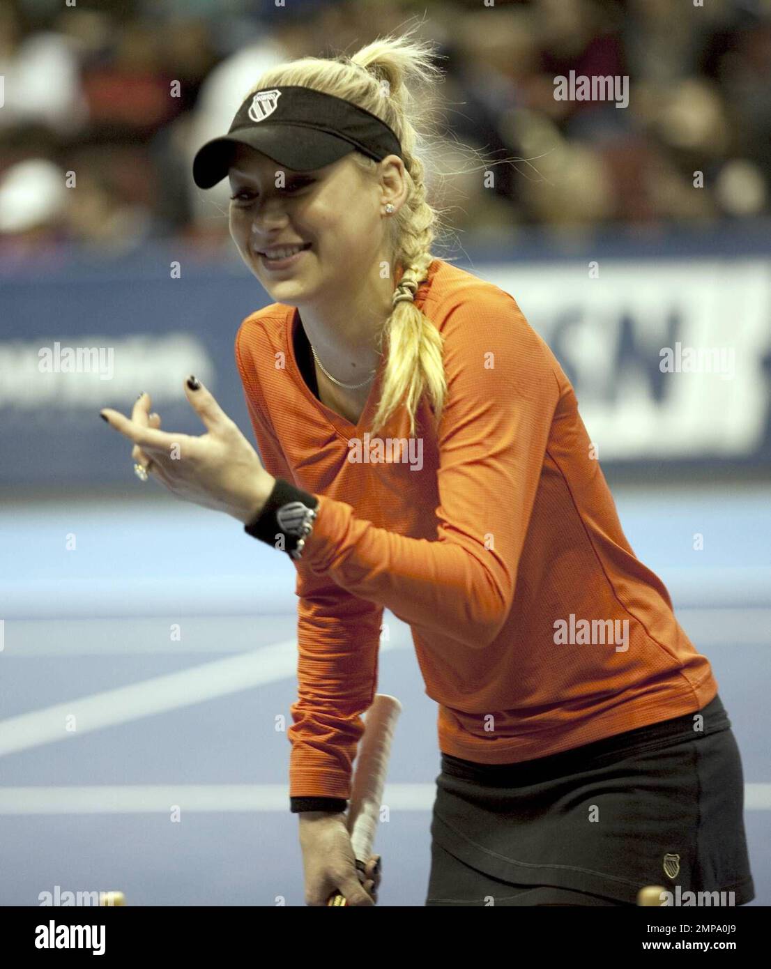 Tennis champion Anna Kournikova plays in a mixed doubles match on ...