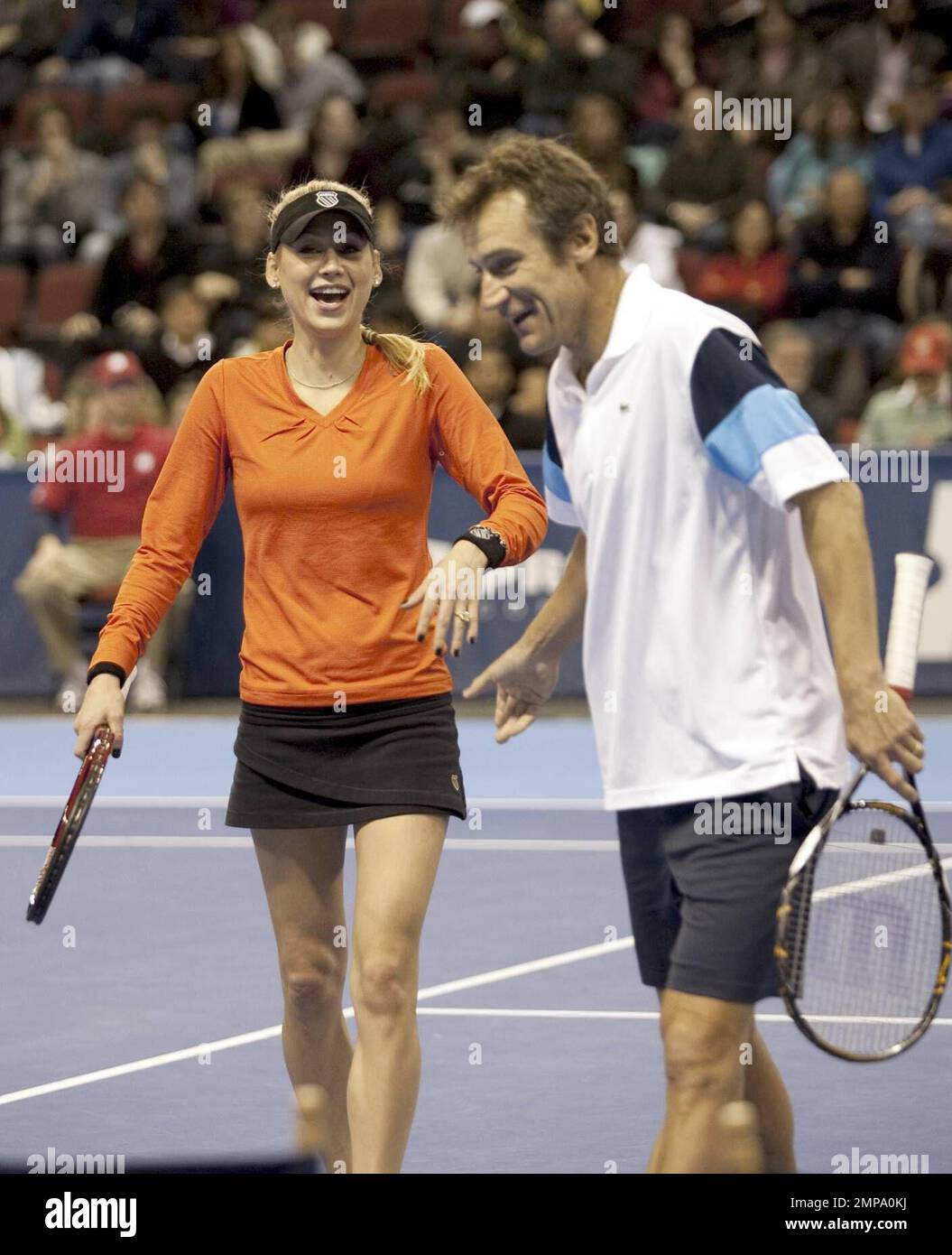 Tennis champion Anna Kournikova plays in a mixed doubles match on ...