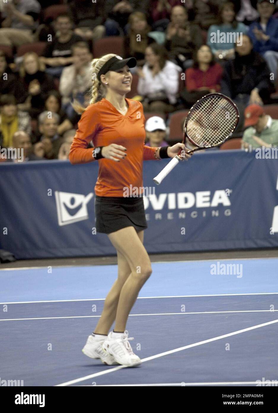 Tennis champion Anna Kournikova plays in a mixed doubles match on ...