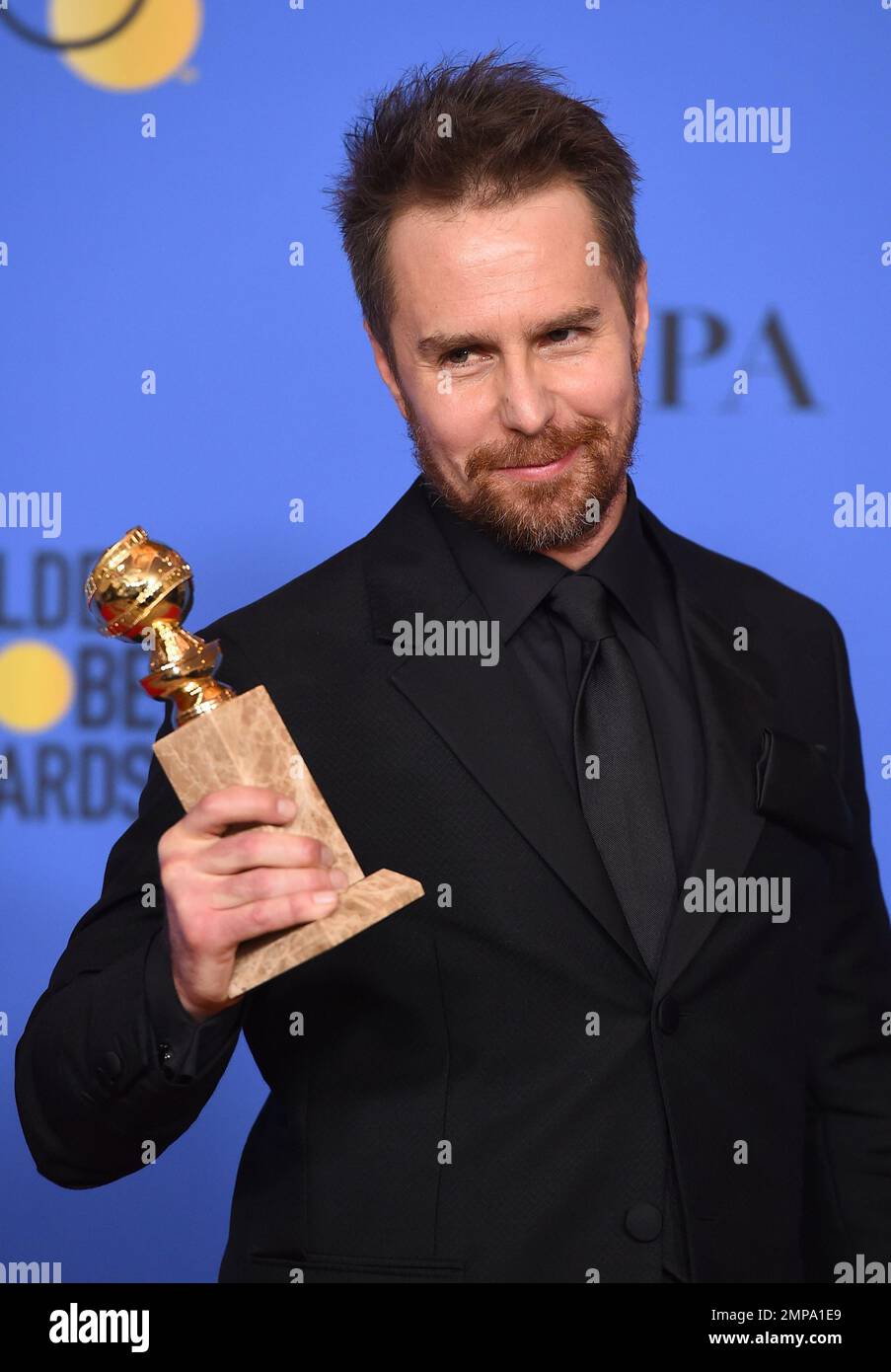 Sam Rockwell poses in the press room with the award for best ...