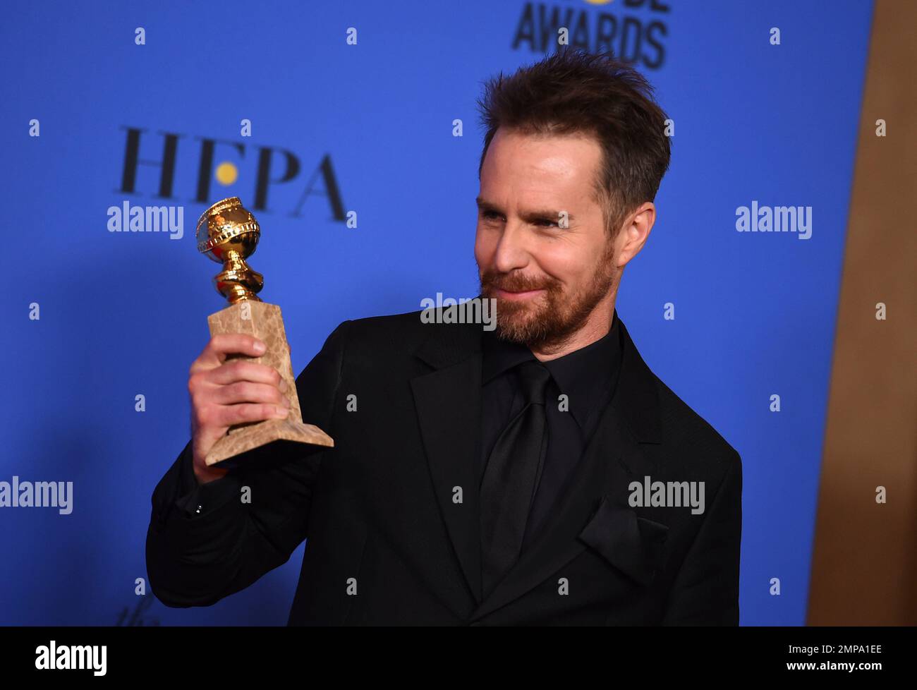 Sam Rockwell poses in the press room with the award for best ...