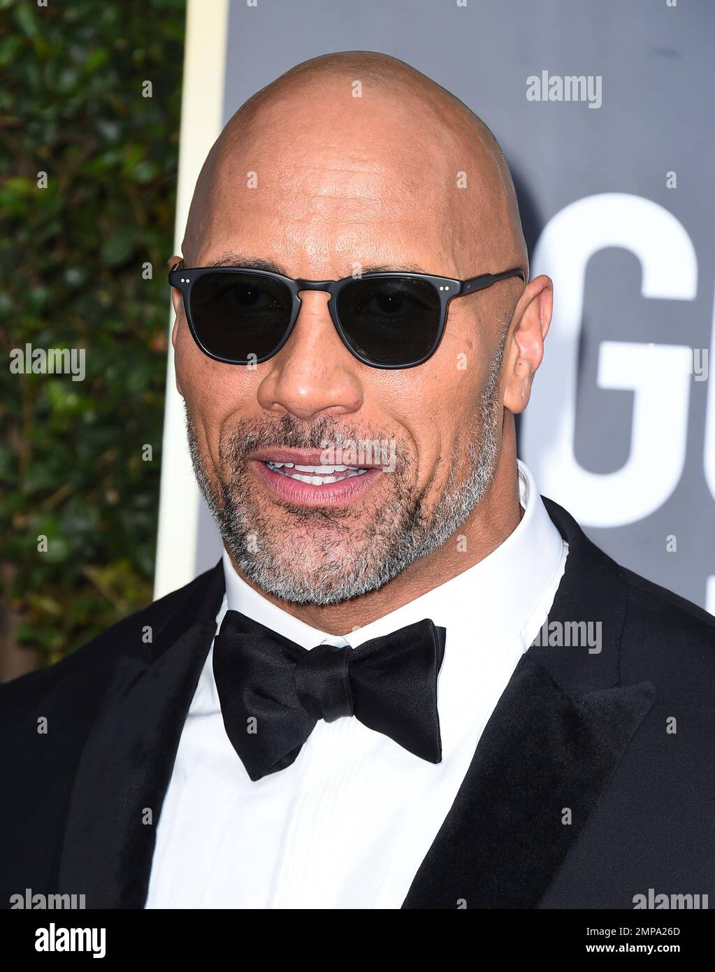 Dwayne Johnson arrives at the 75th annual Golden Globe Awards at the ...