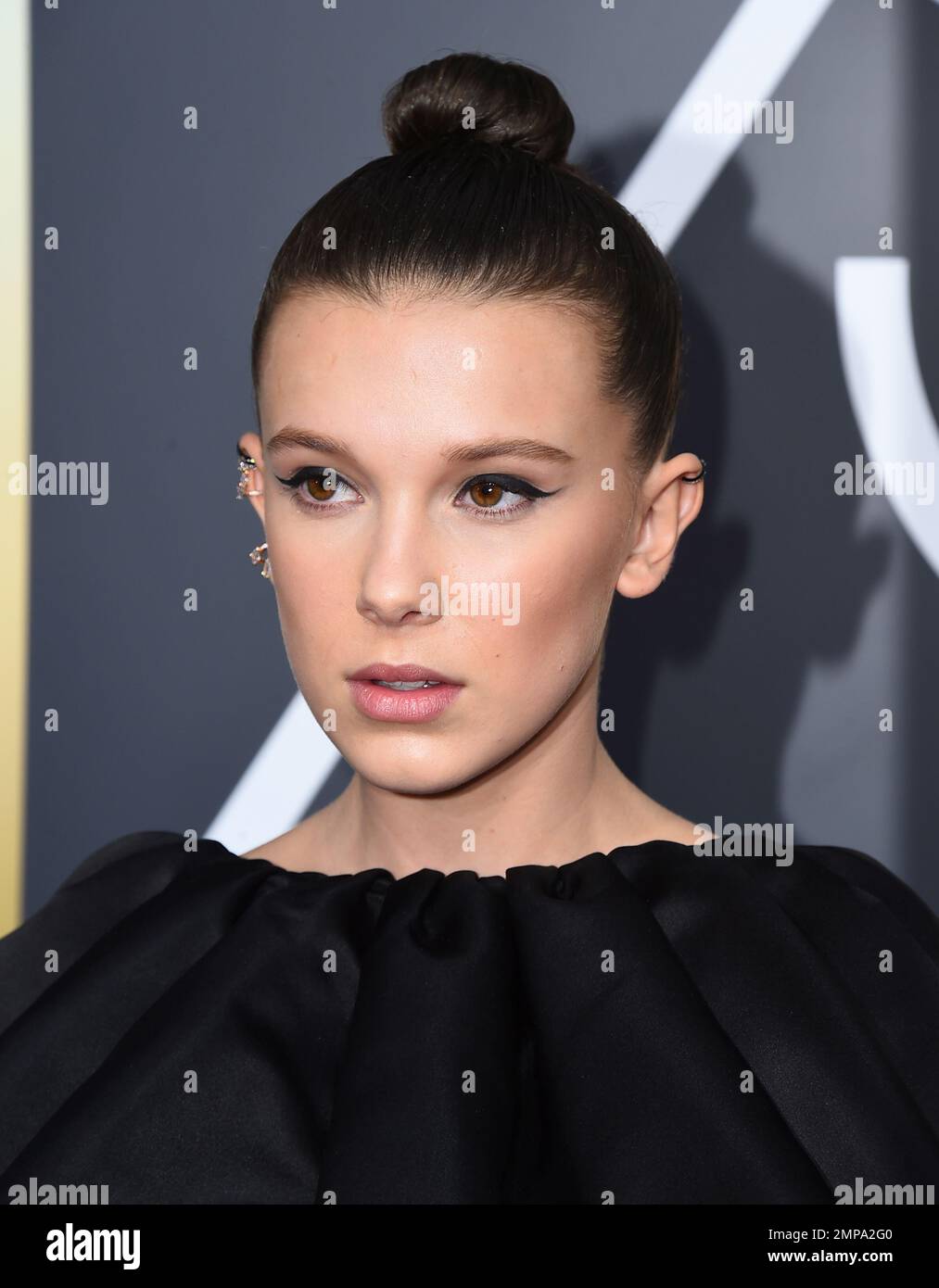 Millie Bobby Brown arrives at the 75th annual Golden Globe Awards at ...