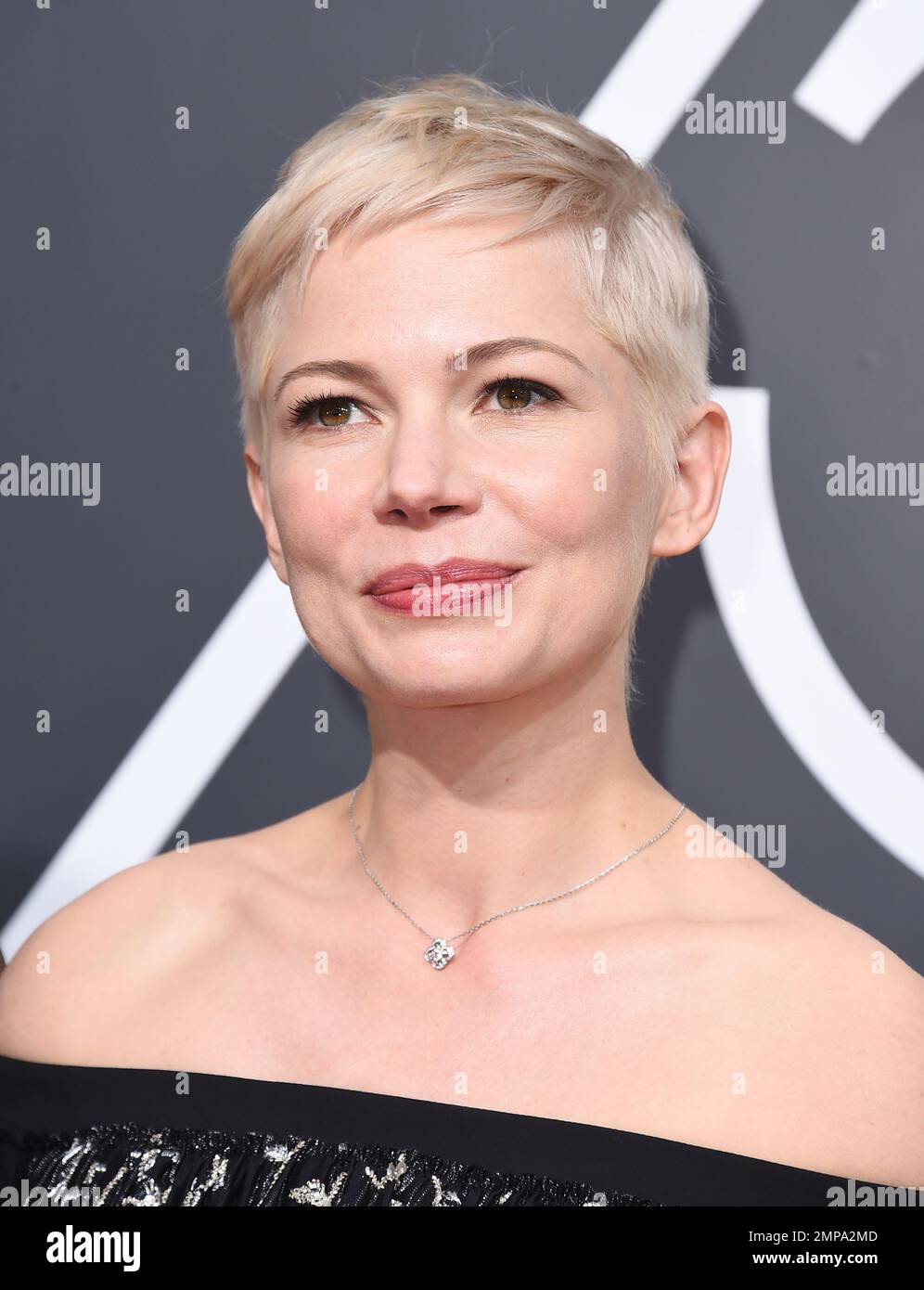 Michelle Williams arrives at the 75th annual Golden Globe Awards at the ...