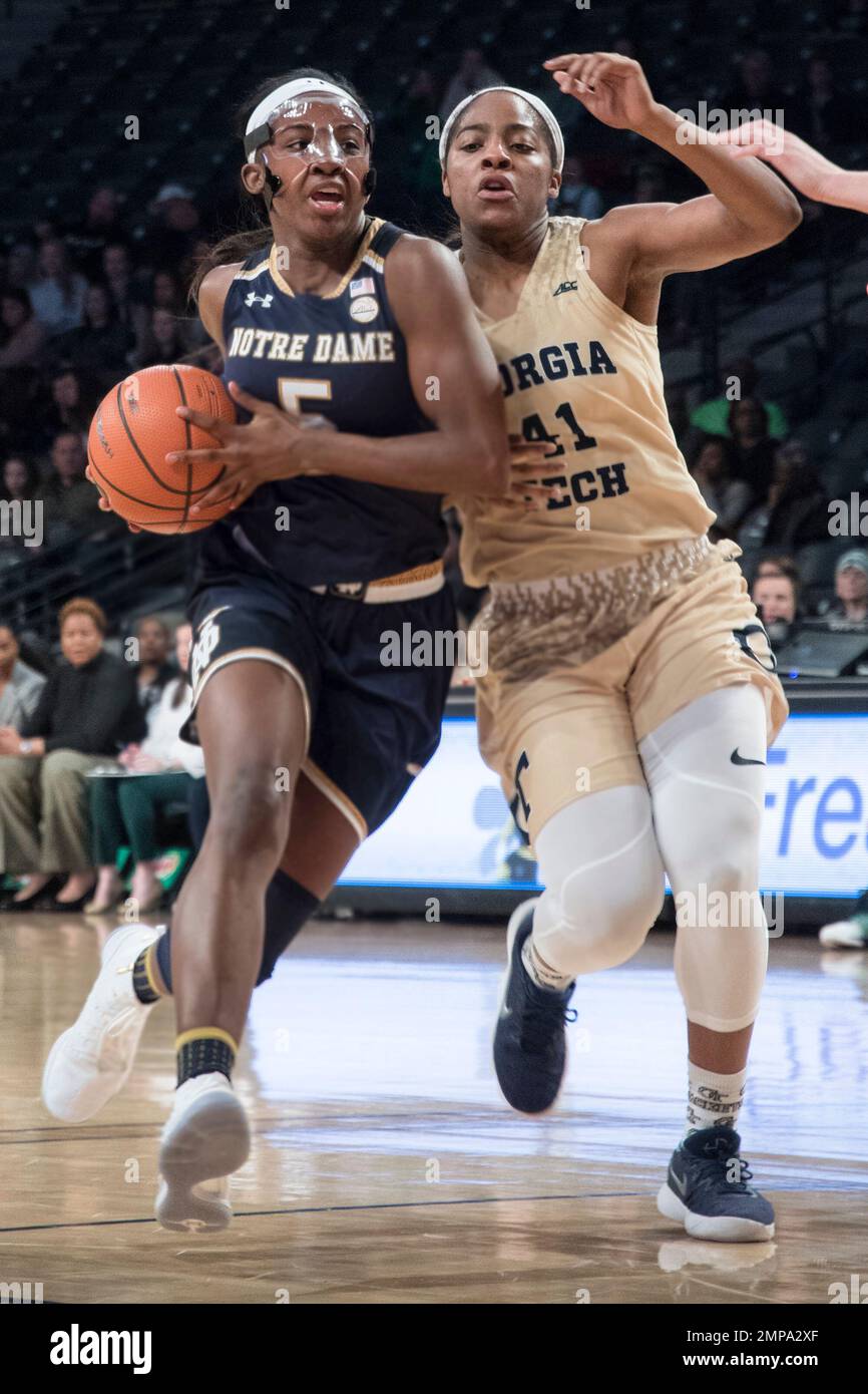 Notre Dame guard Jackie Young (5) drives the lane as Georgia Tech guard ...
