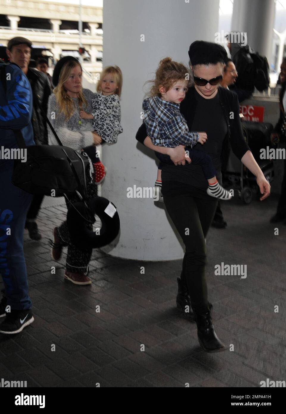 Anna Paquin and Stephen Moyer with twins Charlie and Poppy at LAX ...