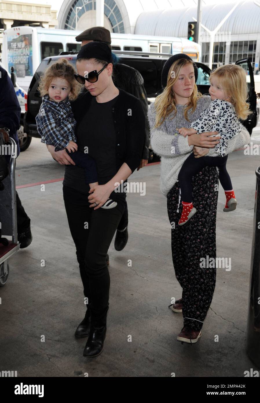 Anna Paquin and Stephen Moyer with twins Charlie and Poppy at LAX ...