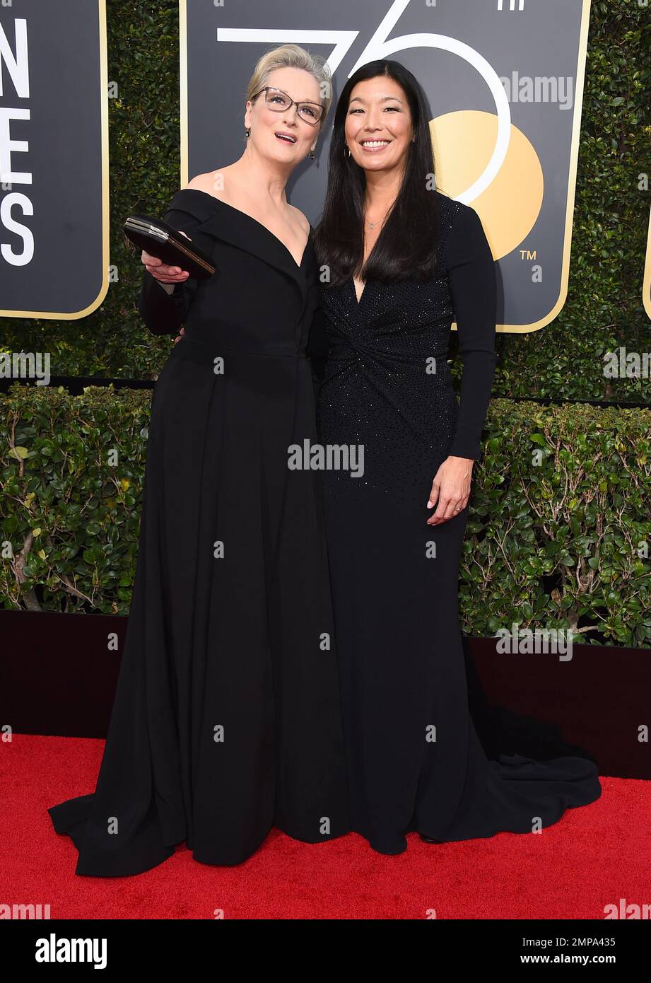 Meryl Streep, left, and Ai-jen Poo arrive at the 75th annual Golden ...