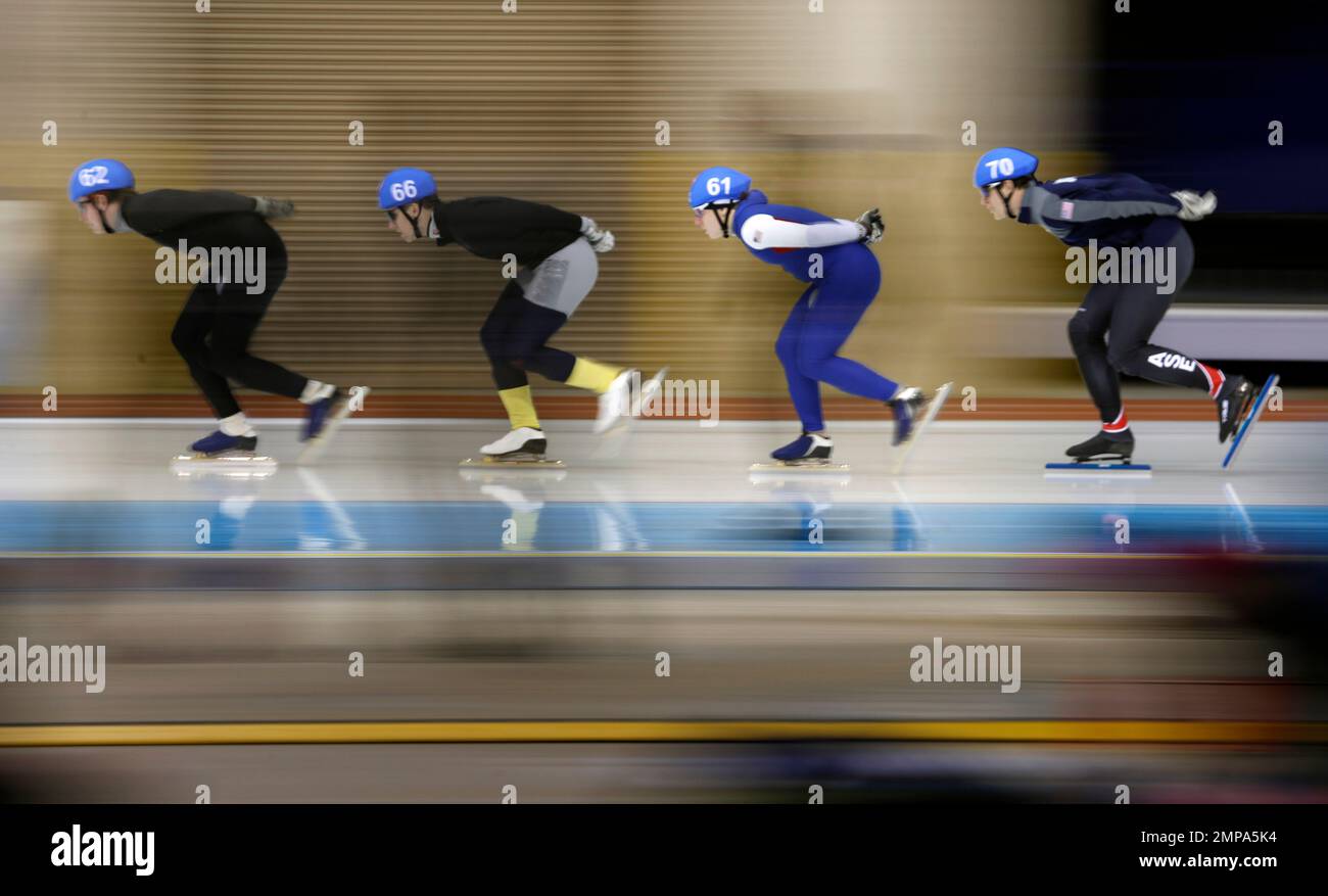 Skaters warm up before the mass start race during the U.S. Olympic long ...